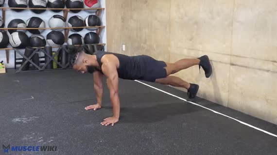MuscleWiki - Leg Raised Push Up - Chest