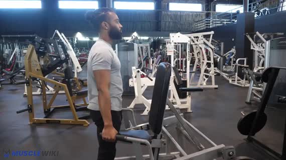 MuscleWiki - Machine Standing Shrug - Traps